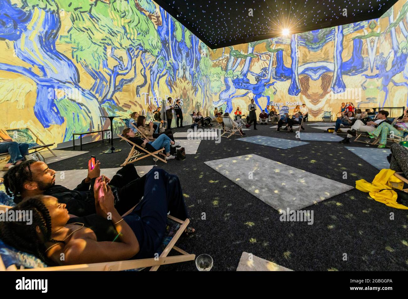 London, UK. 3rd Aug, 2021. The main room with a rolling projection of ...