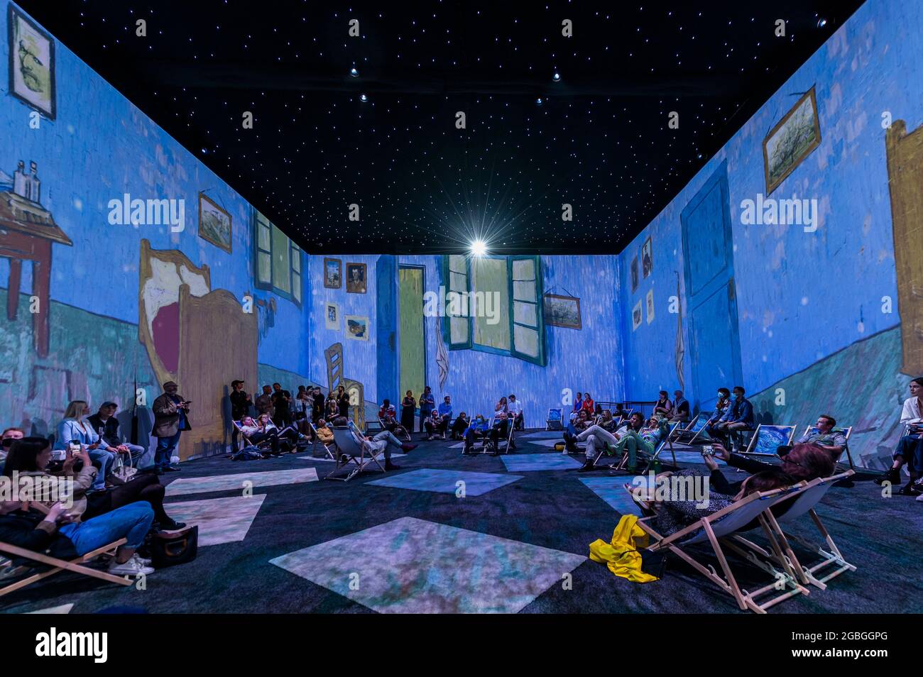 London, UK. 3rd Aug, 2021. The main room with a rolling projection of ...