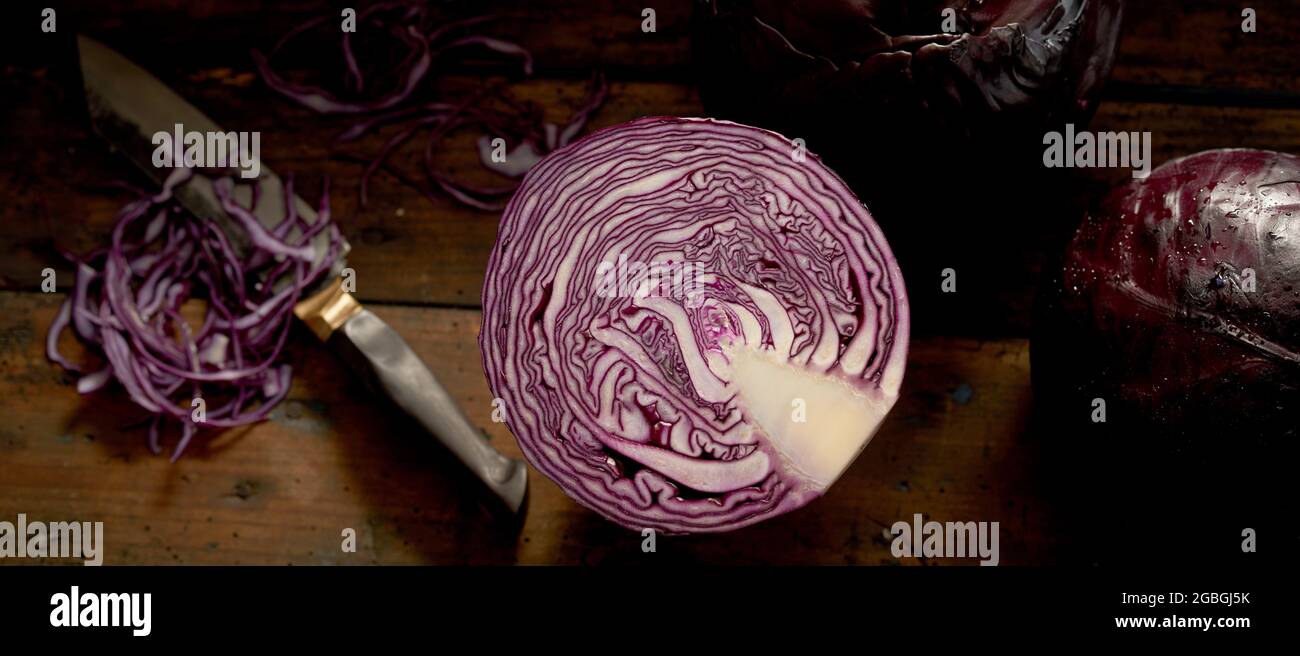 Top view wide angle of chopped raw red cabbage on rustic table with ...
