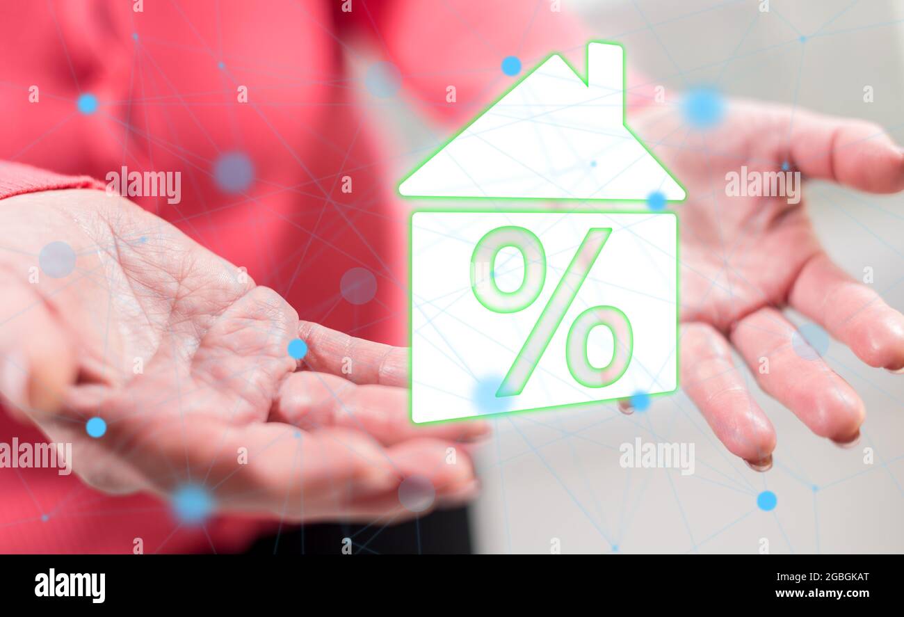 Interest rates concept above the hands of a woman in background Stock ...