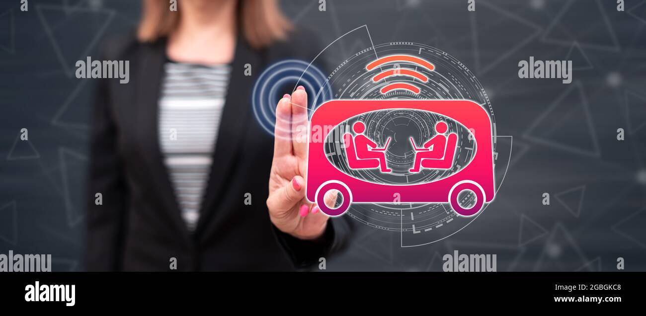 Woman touching a self-driving car concept on a touch screen with her ...