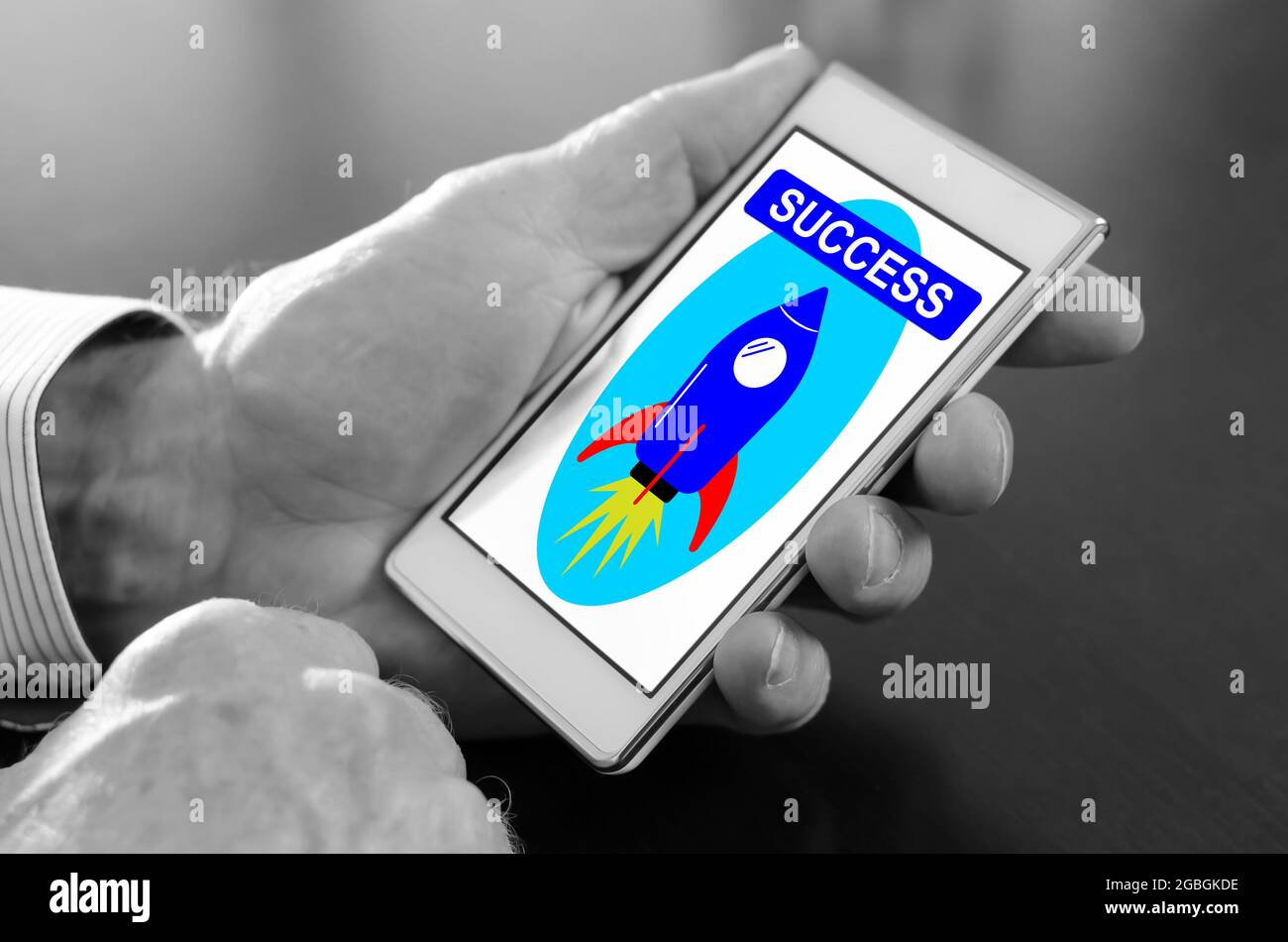 Hand holding a smartphone with success concept Stock Photo - Alamy
