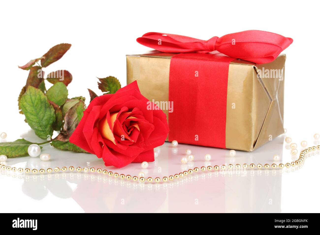 Beautiful red rose with wonderful gift in gold box isolated on white ...
