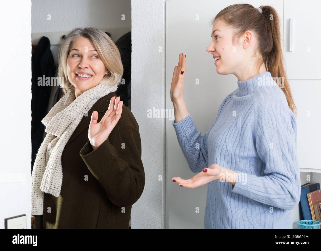 Girl saying goodbye her mother Stock Photo - Alamy