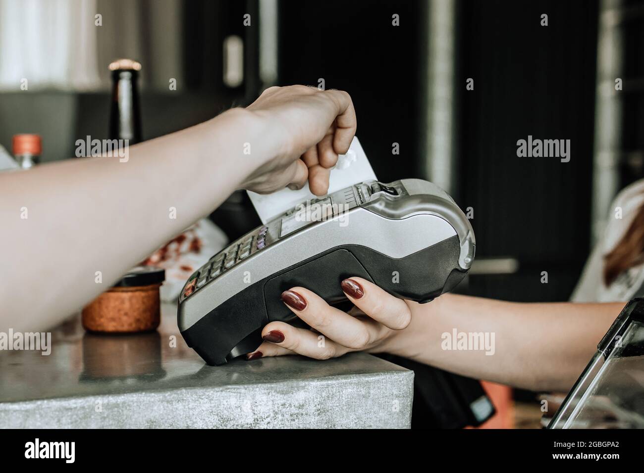 Customer doing payment credit card in cafe or shop Stock Photo - Alamy