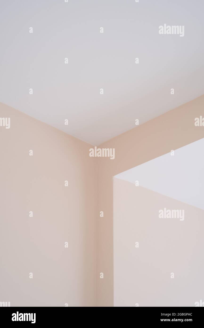 Minimalistic low angle shot of the upper corner of pinky walls Stock ...