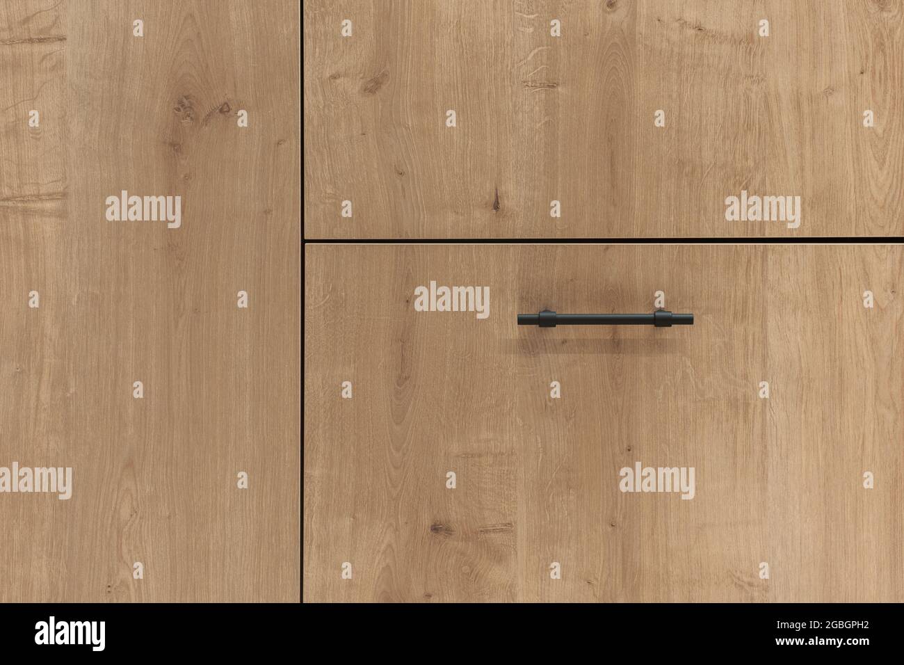 Closed wooden drawer with a small black handle Stock Photo - Alamy
