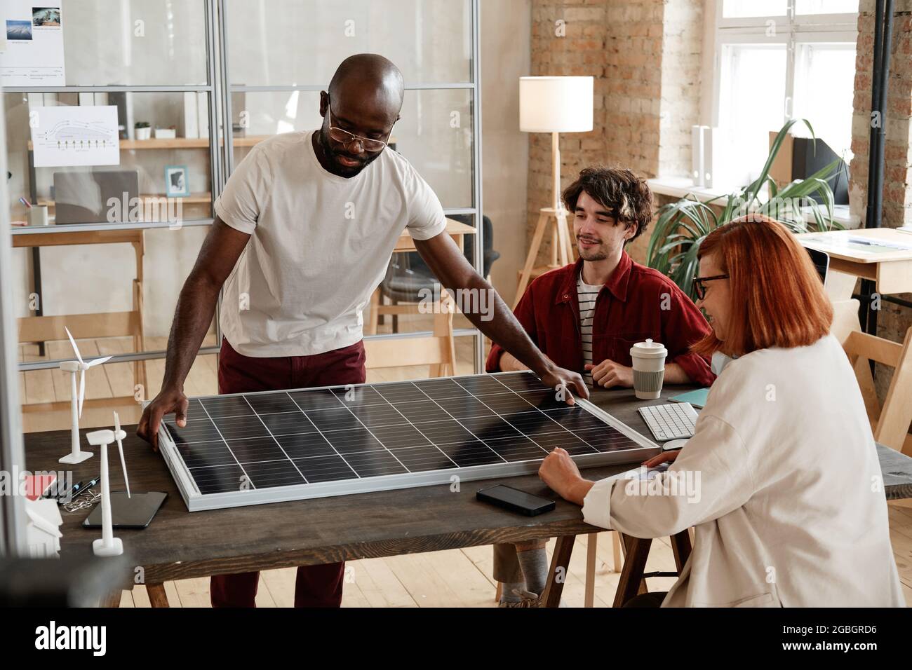 Group of engineers working at the table in team they developing new ...