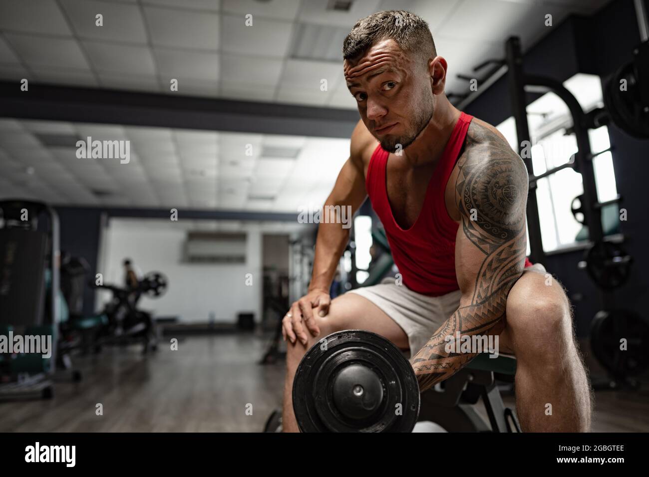 Portrait of man bodybuilder in red shirt in gym Stock Photo - Alamy