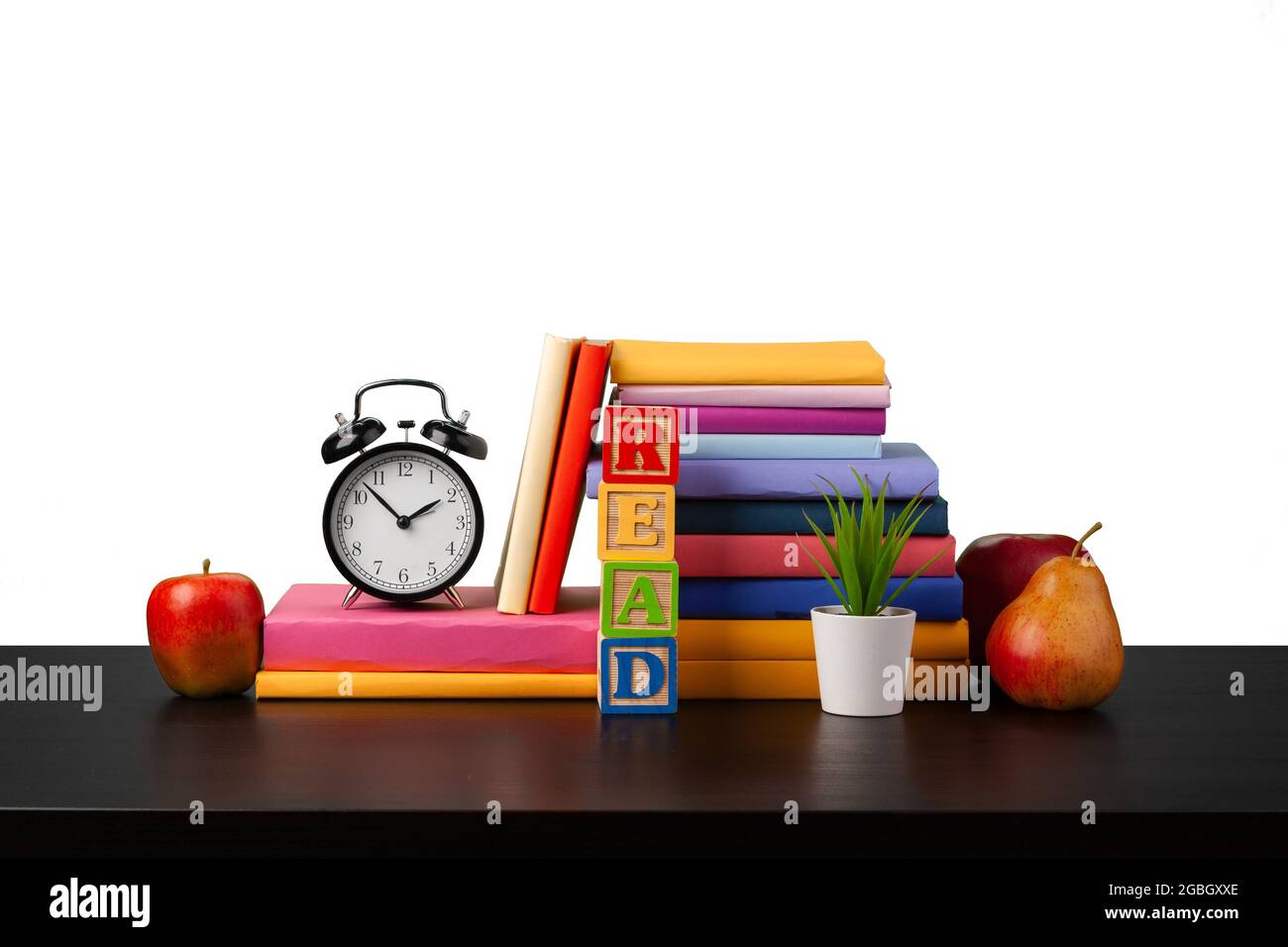 Stack of books and alarm clock, time to read concept Stock Photo - Alamy