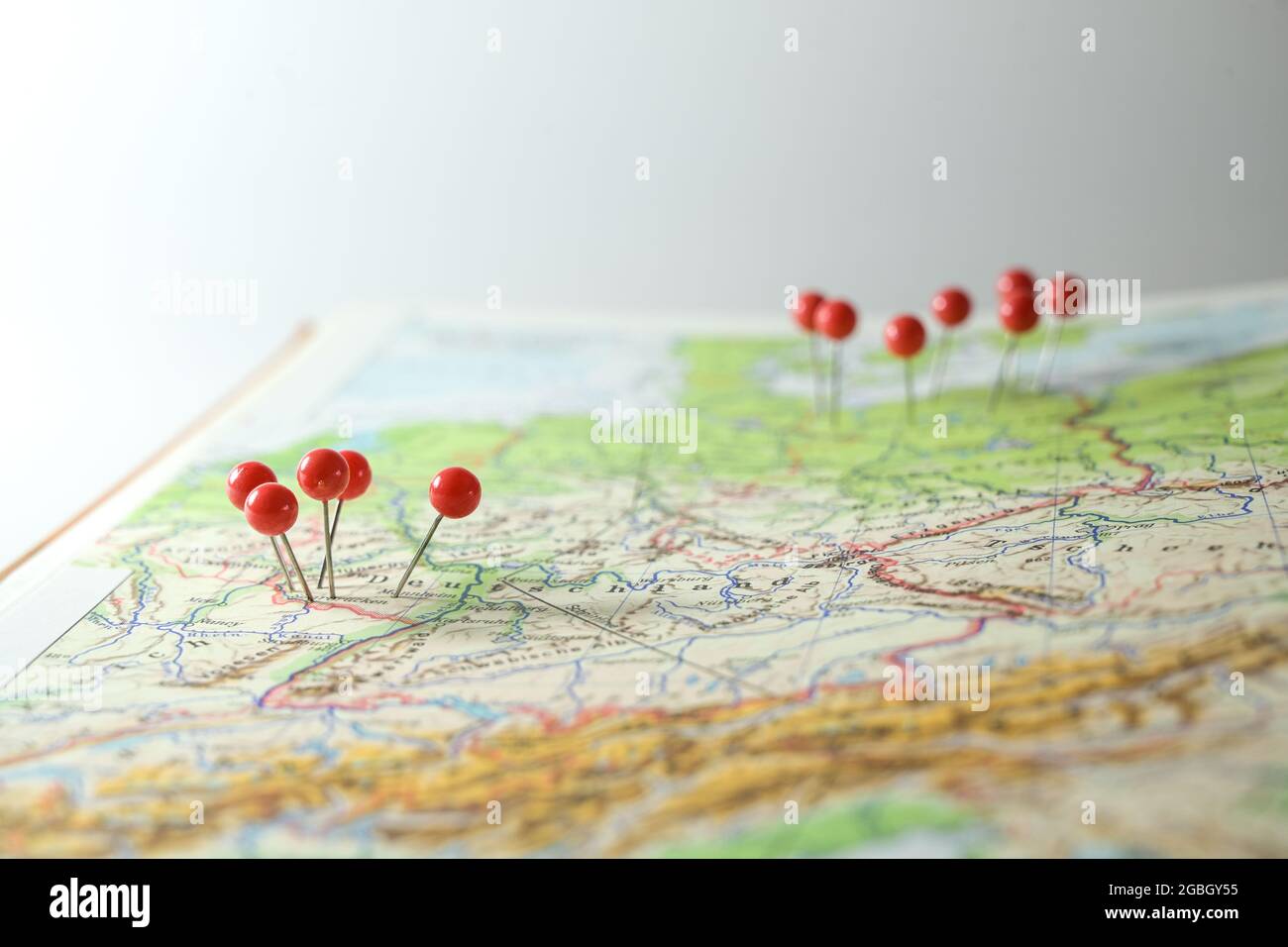 Closeup shot of pins on different spots on a map Stock Photo - Alamy