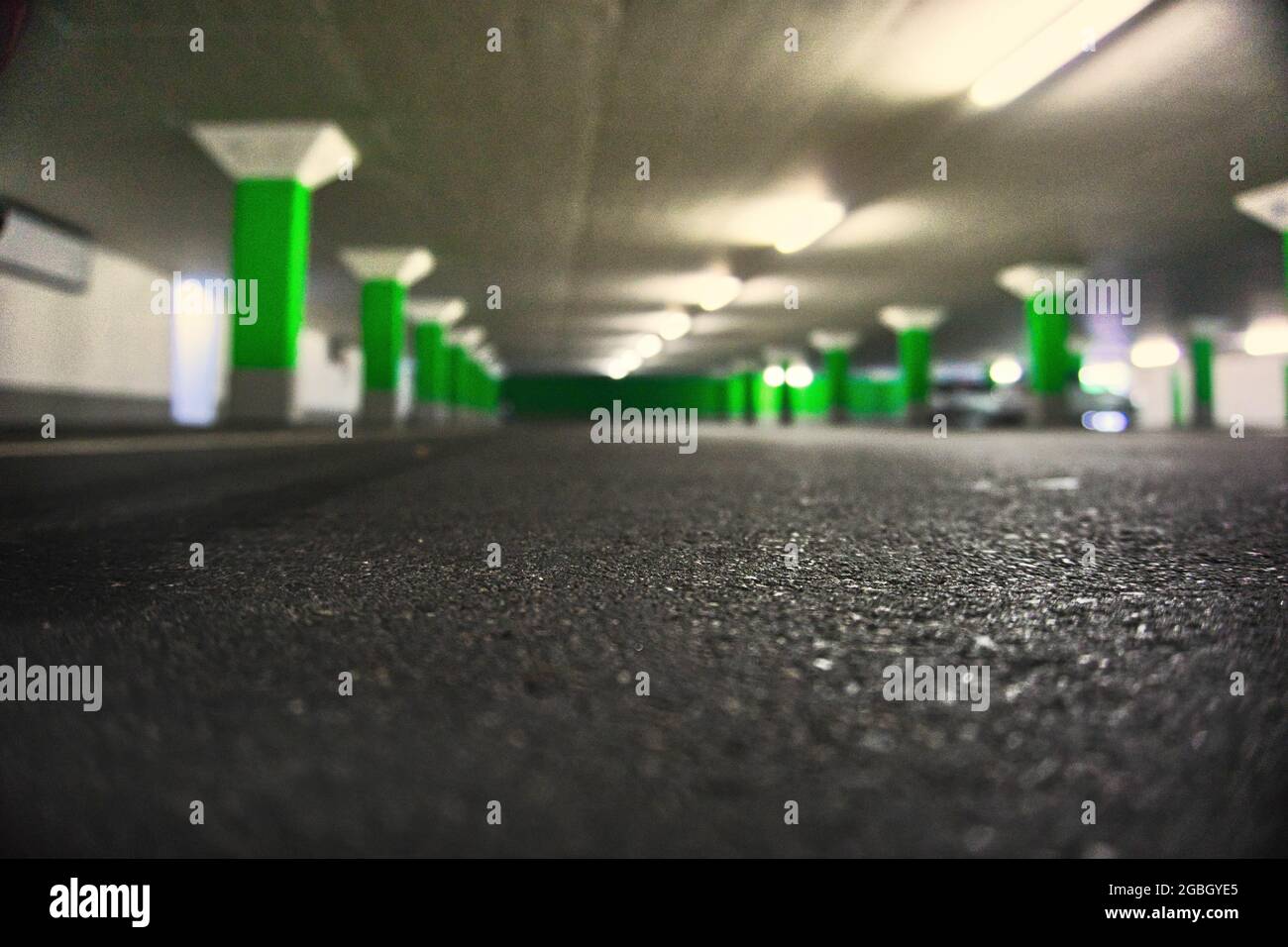 Low angle shot of the asphalt inside an empty parking lot Stock Photo ...