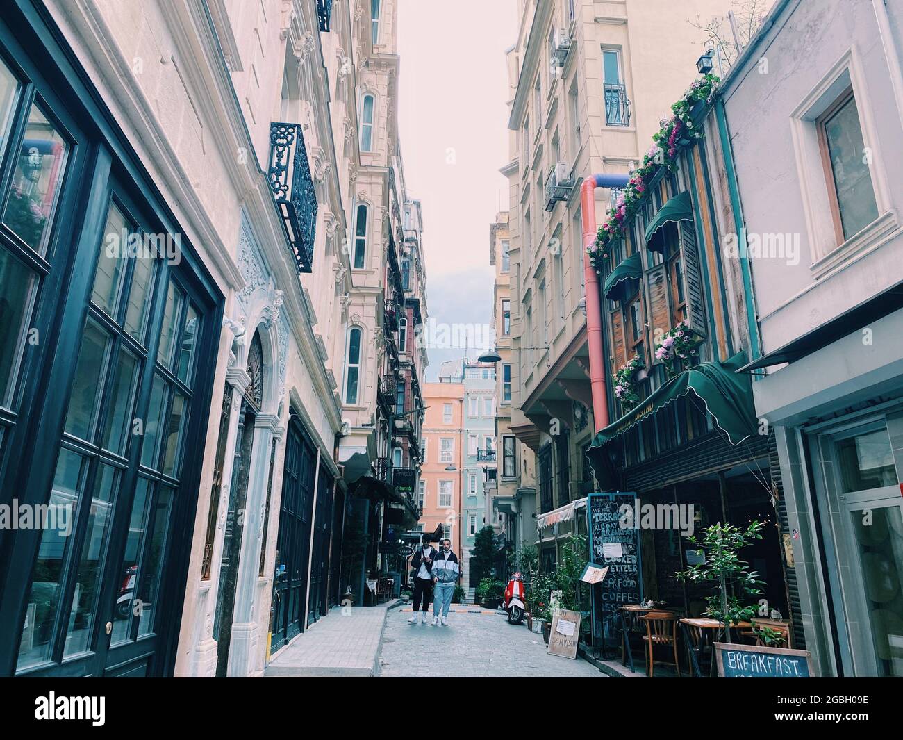 ISTANBUL, TURKEY - Jun 03, 2021: people walking down a narrow street ...