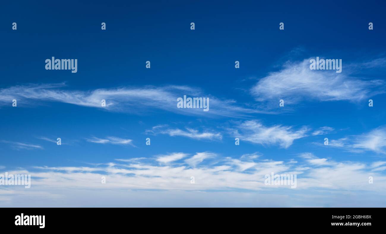 Blue clear sky with clouds Stock Photo - Alamy