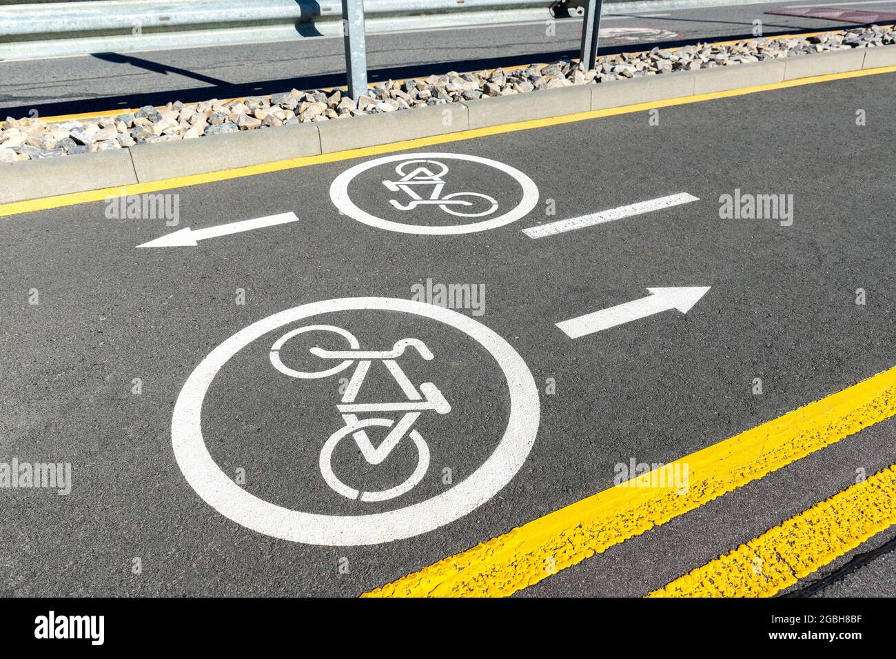 City street asphalt road with separated two way direction bicycle lane ...