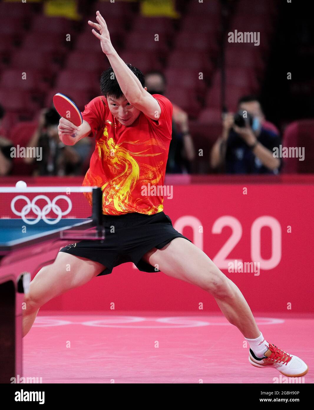 Tokyo, Japan. 4th Aug, 2021. Ma Long of China hits a return during the ...