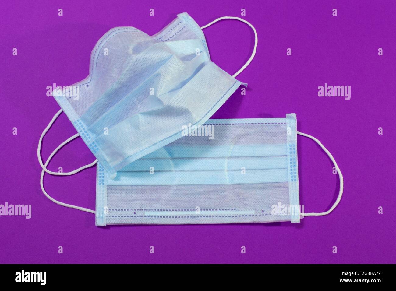 medical mask on a purple background, personal protective equipment ...