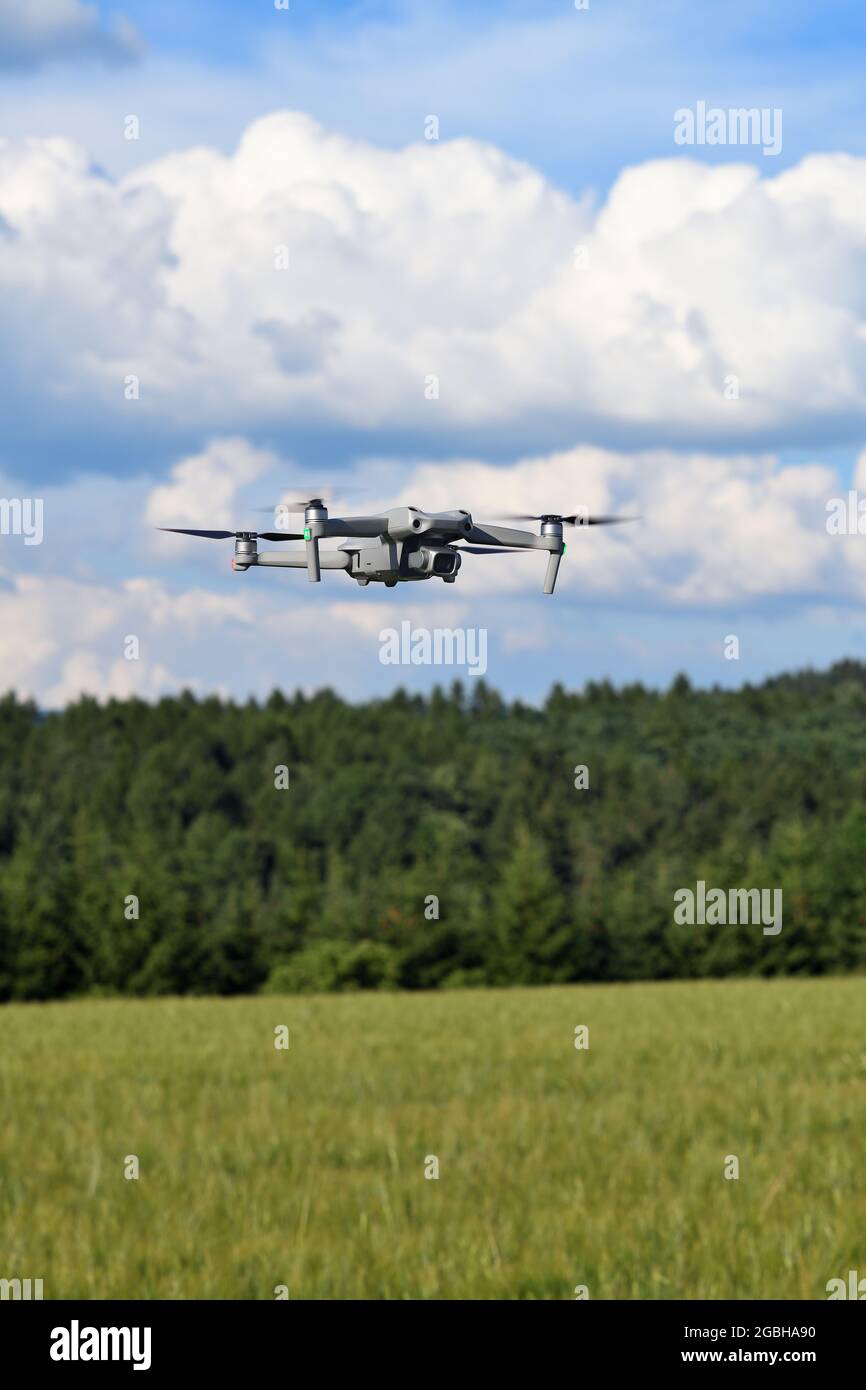 UAV drone copter flying with digital camera. View of a photography ...