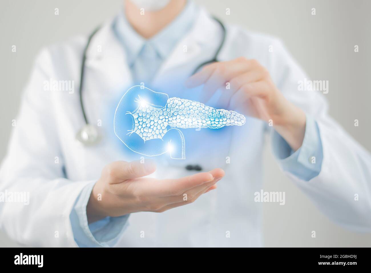 Female doctor holding virtual Pancreas in hand. Handrawn human organ ...