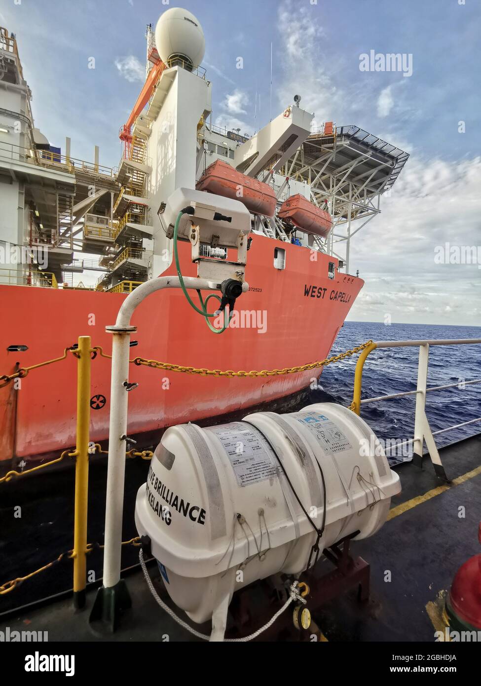 MPSV or multi purpose supply vessel alongside with drilling vessel to ...