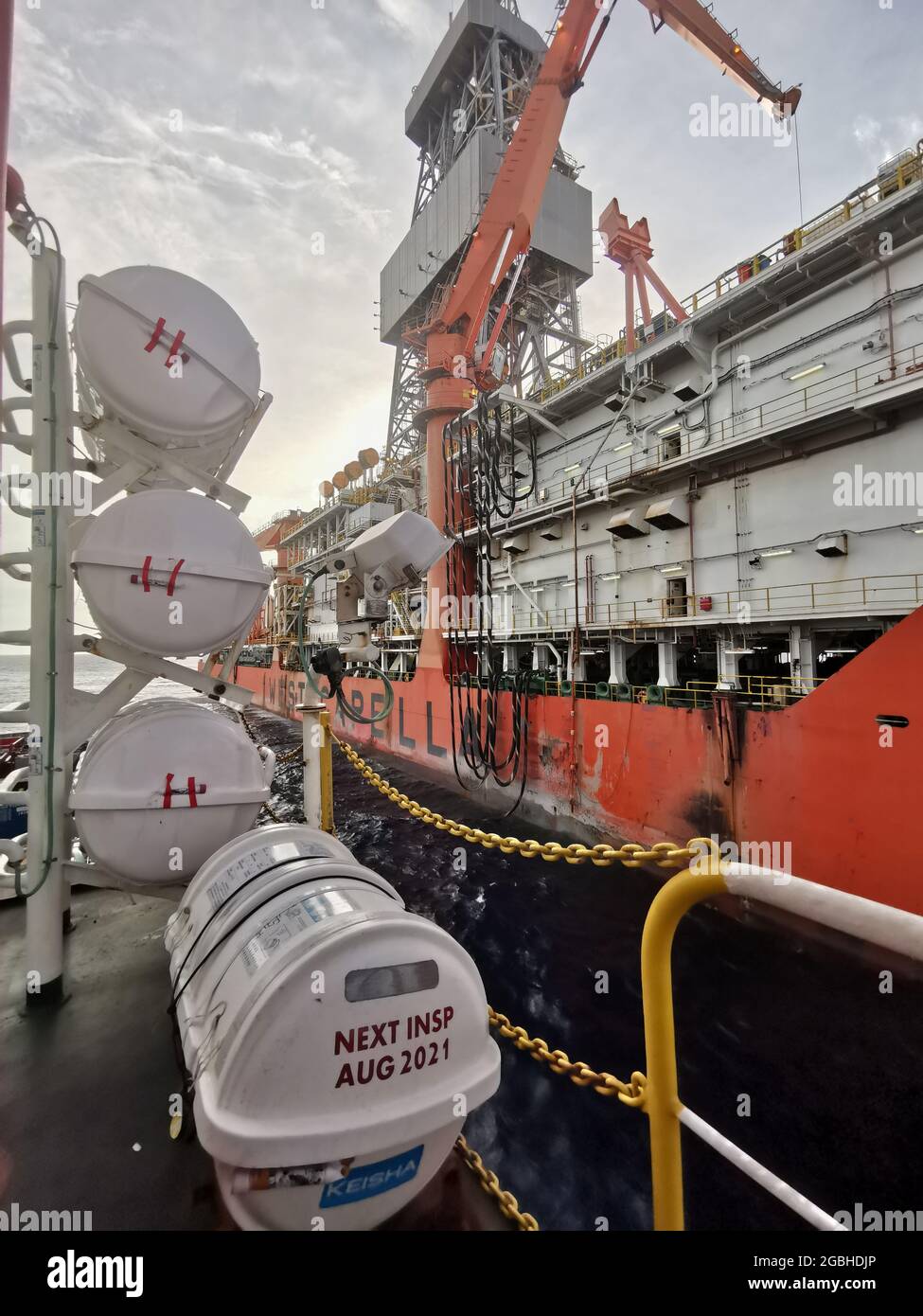 MPSV or multi purpose supply vessel alongside with drilling vessel to ...