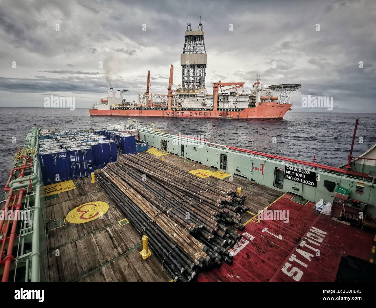 MPSV or multi purpose supply vessel alongside with drilling vessel to ...