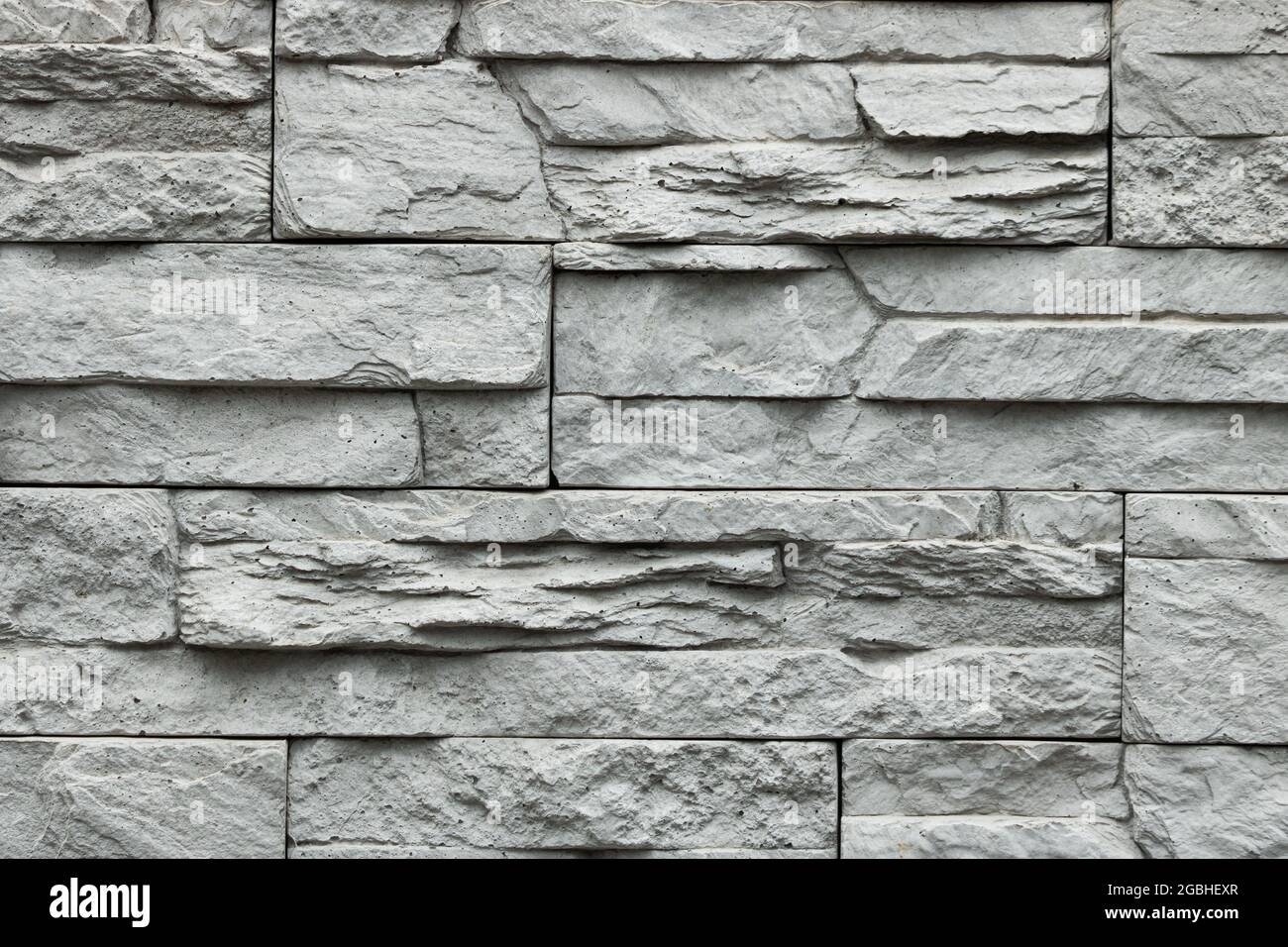 Grey cobblestone wall texture for backgrounds Stock Photo - Alamy