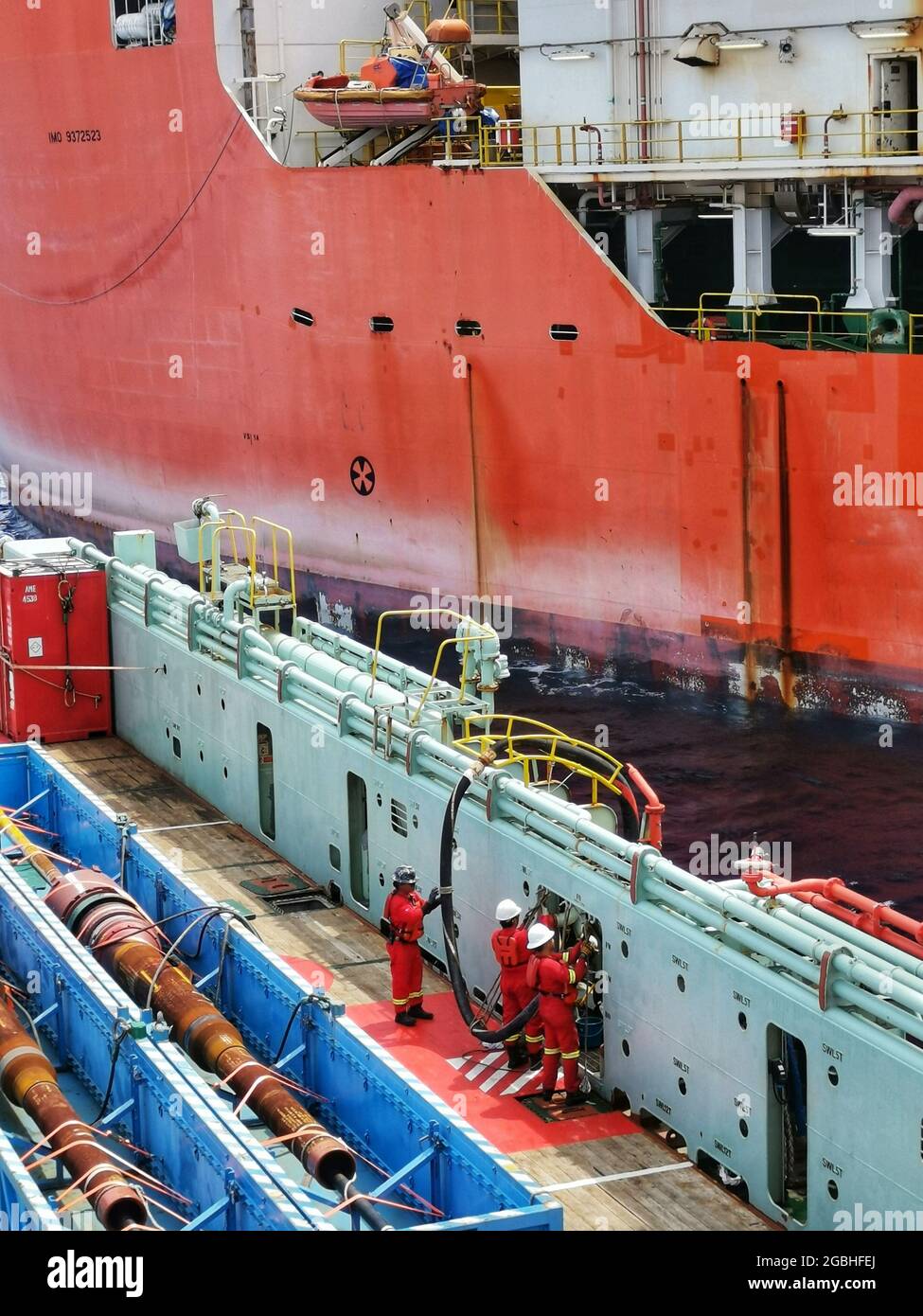 MPSV or multi purpose supply vessel alongside with drilling vessel to ...