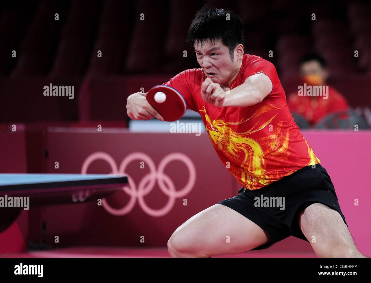 Tokyo, Japan. 4th Aug, 2021. Fan Zhendong of China hits a return during ...