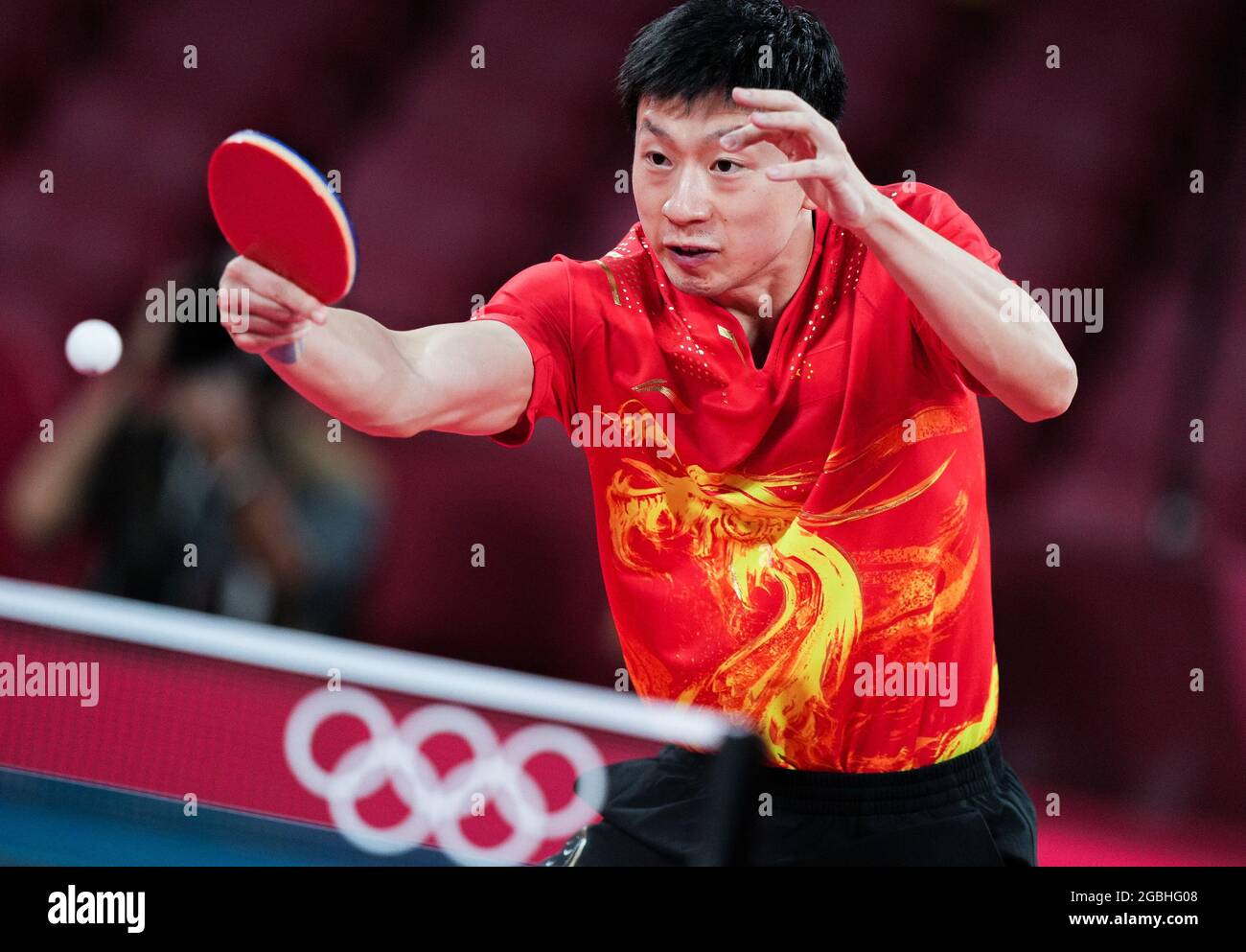 Tokyo, Japan. 4th Aug, 2021. Ma Long of China hits a return during the ...