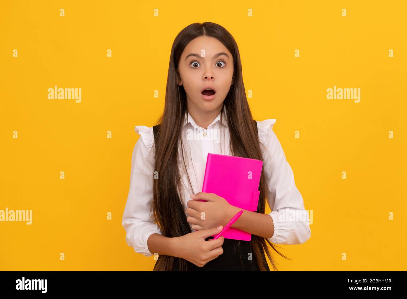 Education with fun learning. Shocked kid hold book yellow background ...