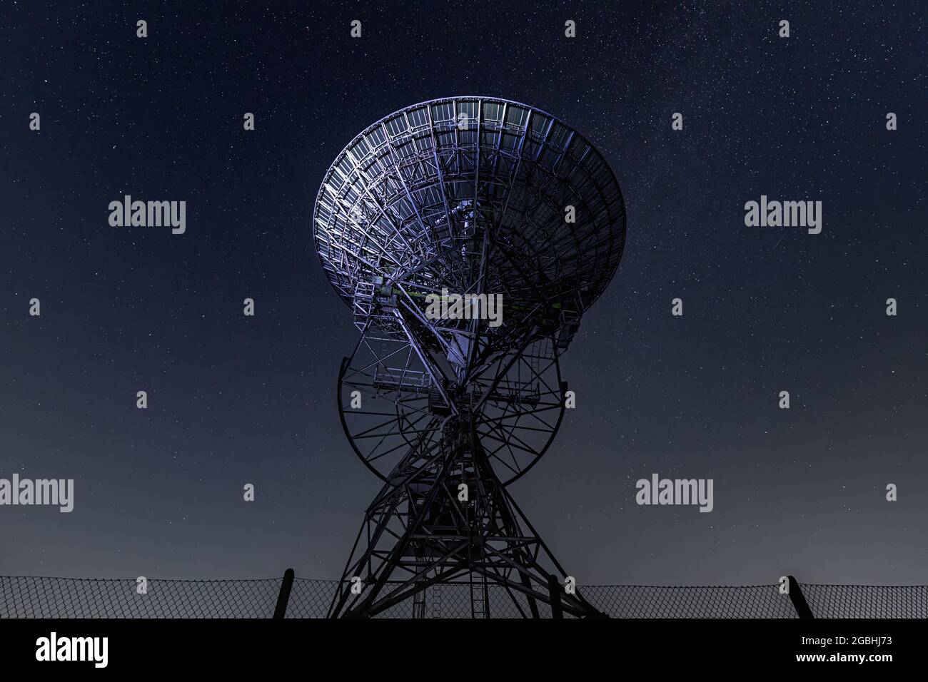 Eerie scenery of a radio telescope on a starry night Stock Photo - Alamy