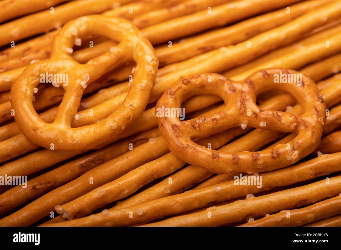 Bread sticks and bread figures with salt. Close-up Background image ...
