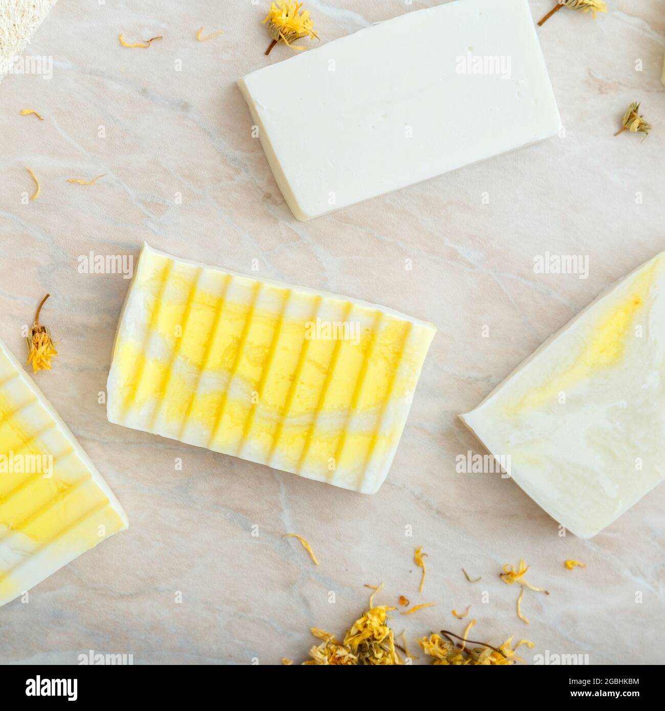 Natural olive soap bars pattern with herbs dry marigold flowers. Many ...