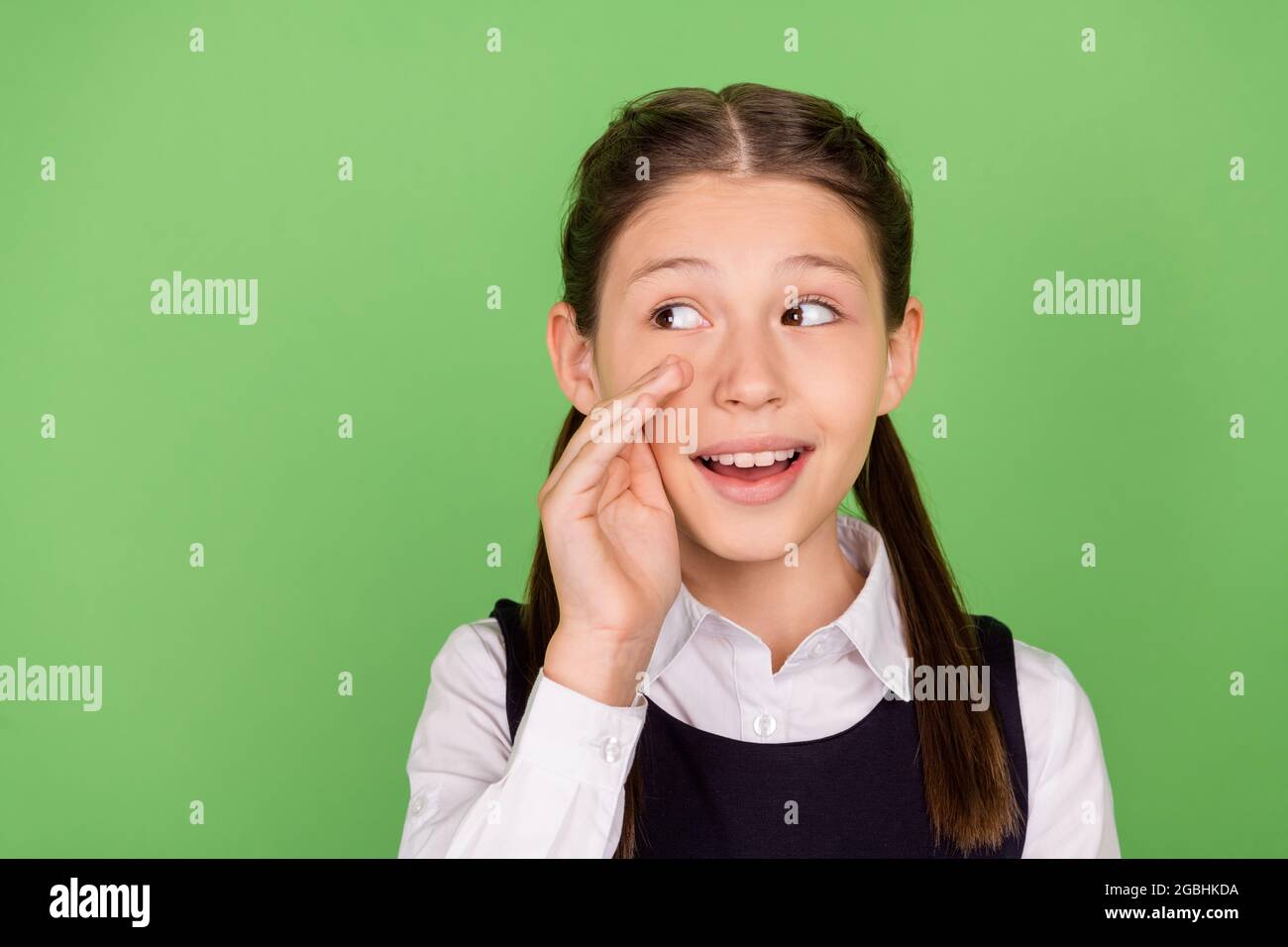 Photo of young school girl happy positive smile hand near mouth speak ...