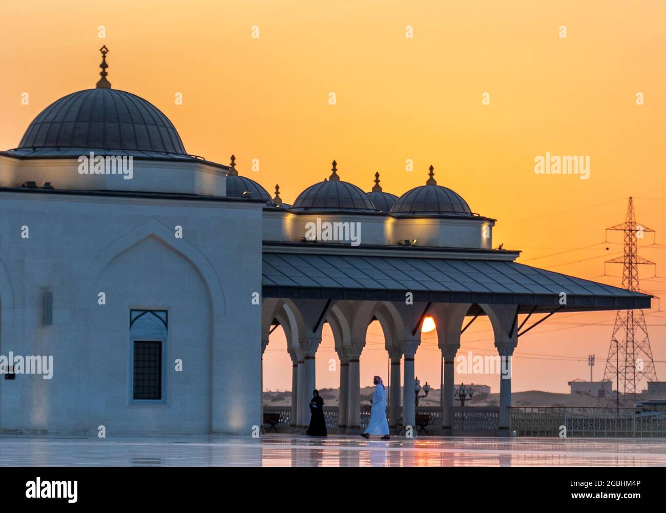 Arab men and women going to mosque for evening prayer Stock Photo - Alamy