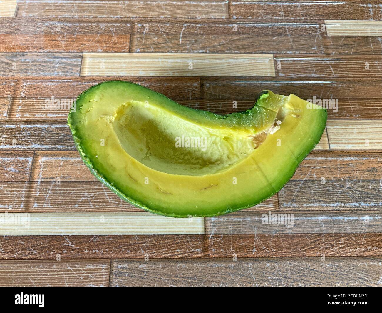 Fresh avocado cut in half Stock Photo - Alamy
