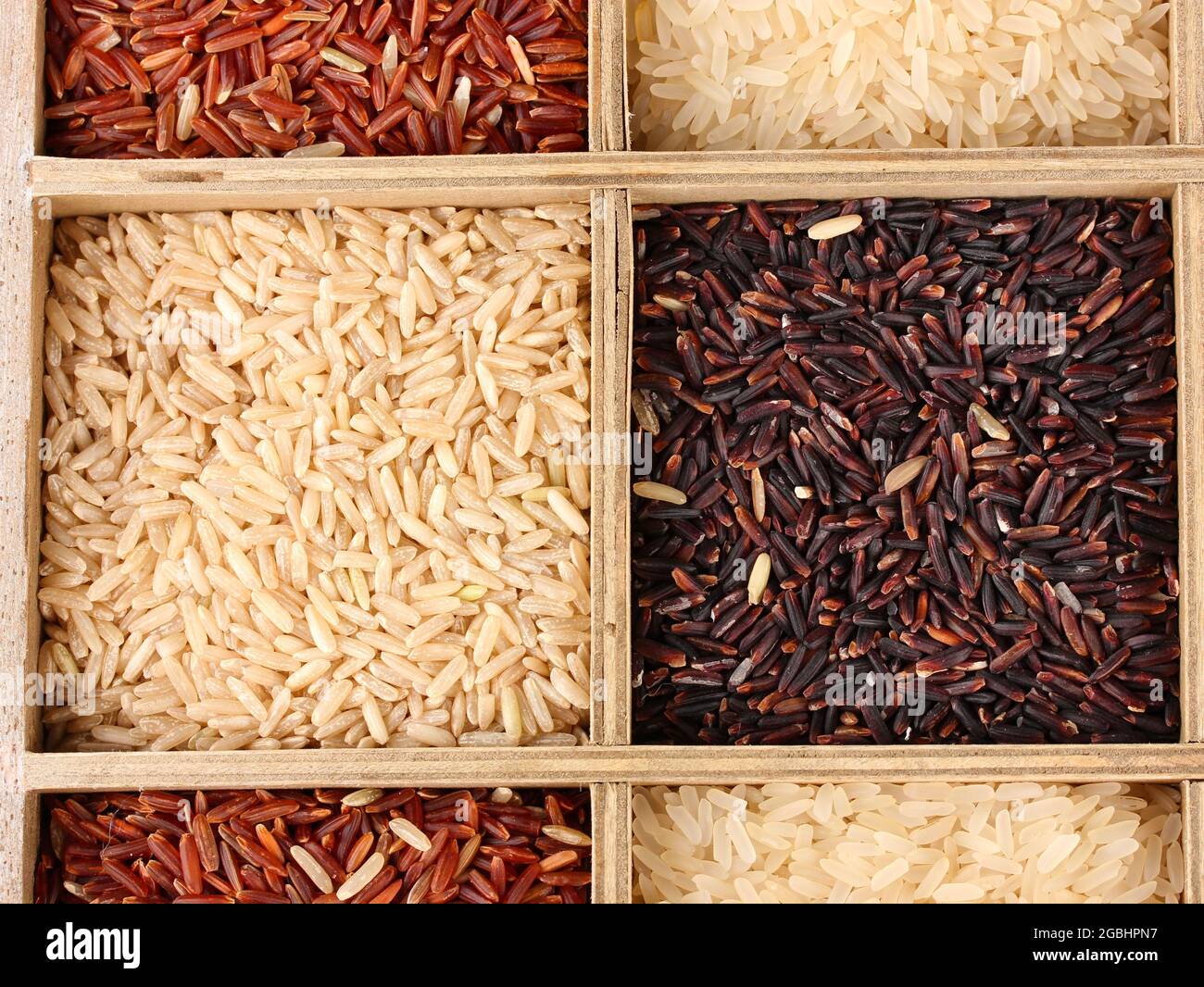 different types of rice in wooden box Stock Photo - Alamy