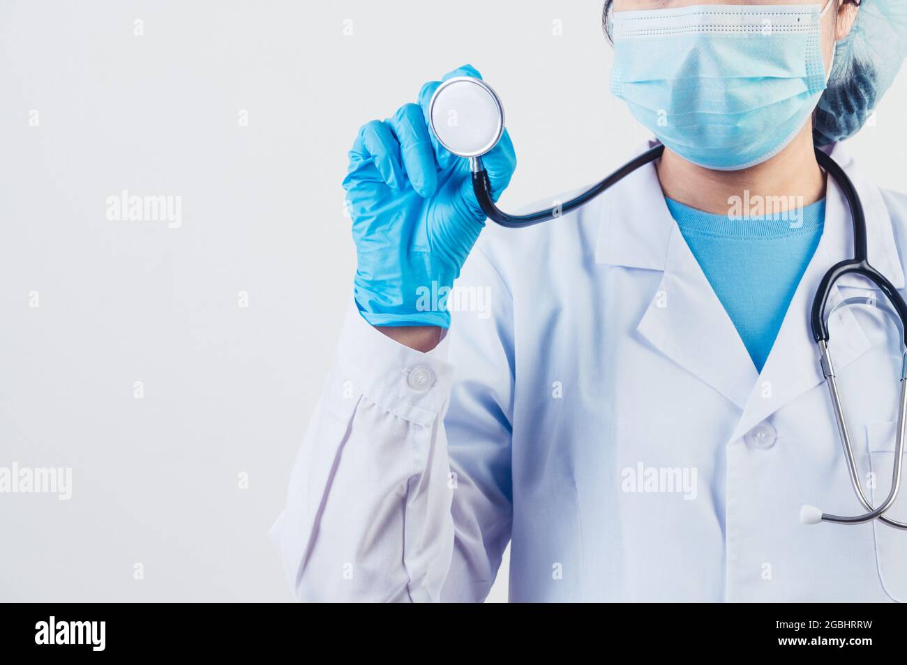 Closeup stethoscope in doctor hands with copy space on white background ...
