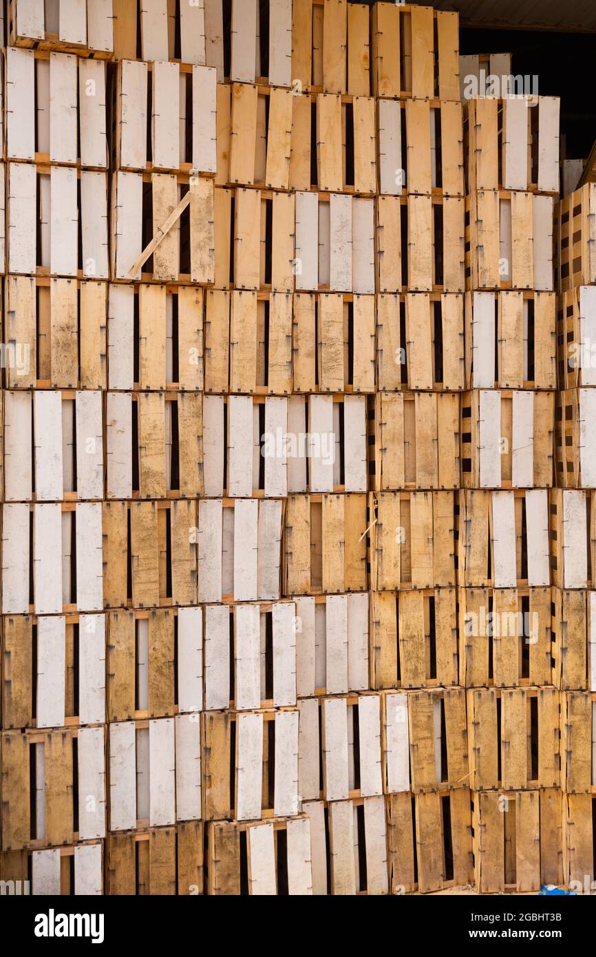 Old and used wooden boxes stacked Stock Photo - Alamy
