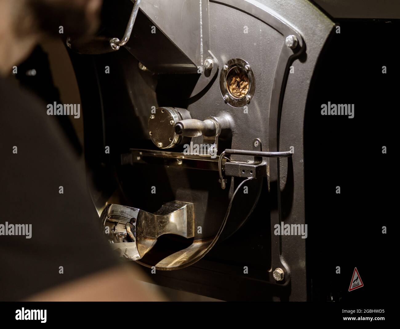 Modern coffee roasting machine with various metal parts Stock Photo - Alamy