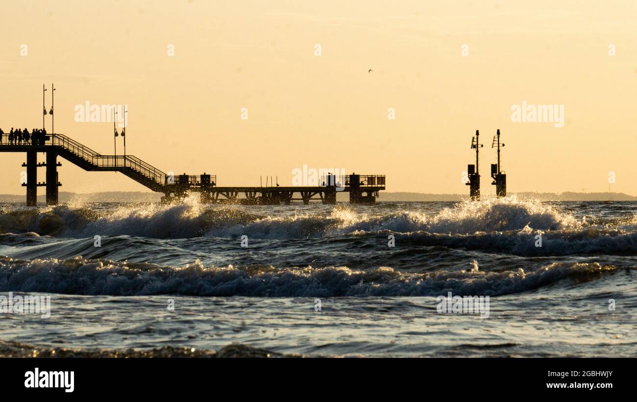 waves and water bridge during sunset Stock Photo - Alamy