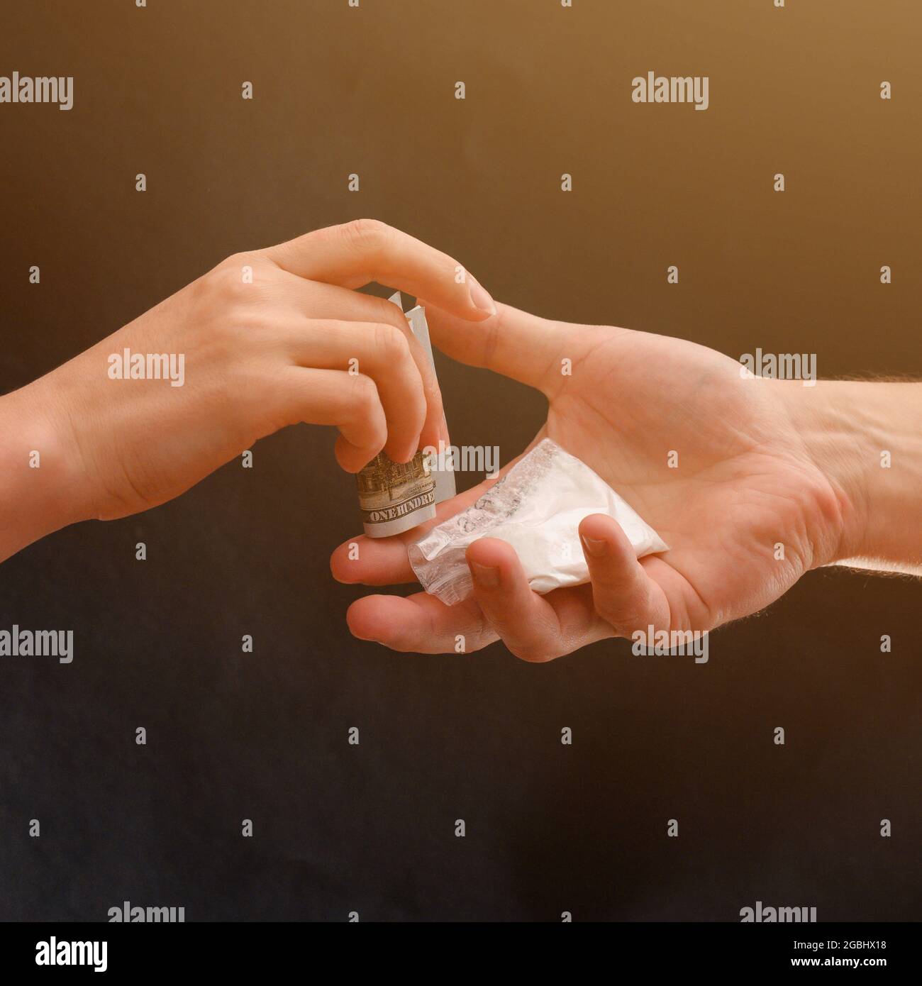 Addict buys a dose of drugs, white powder in a sachet on a black ...