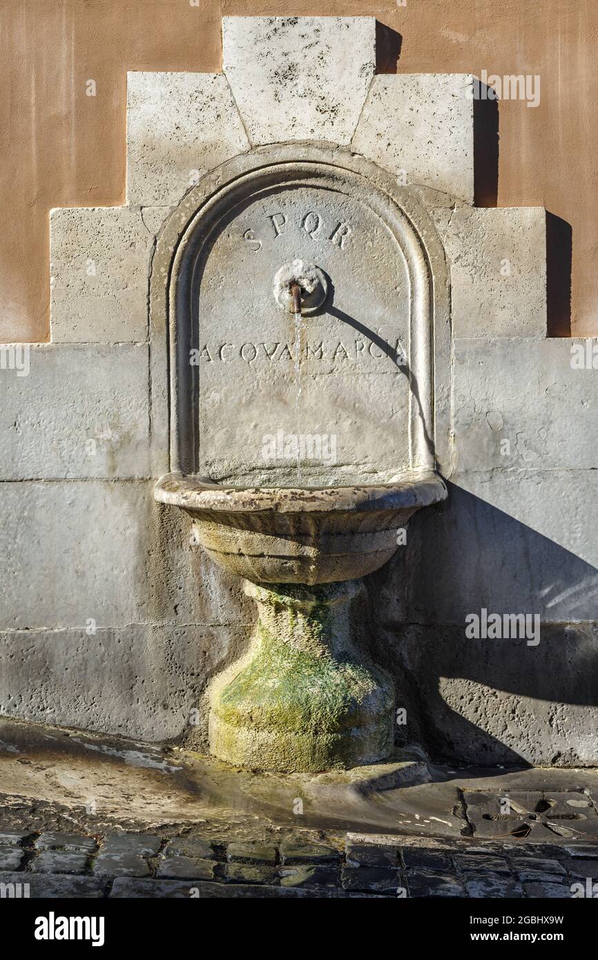 Drinking water fountain on street in Rome Stock Photo - Alamy