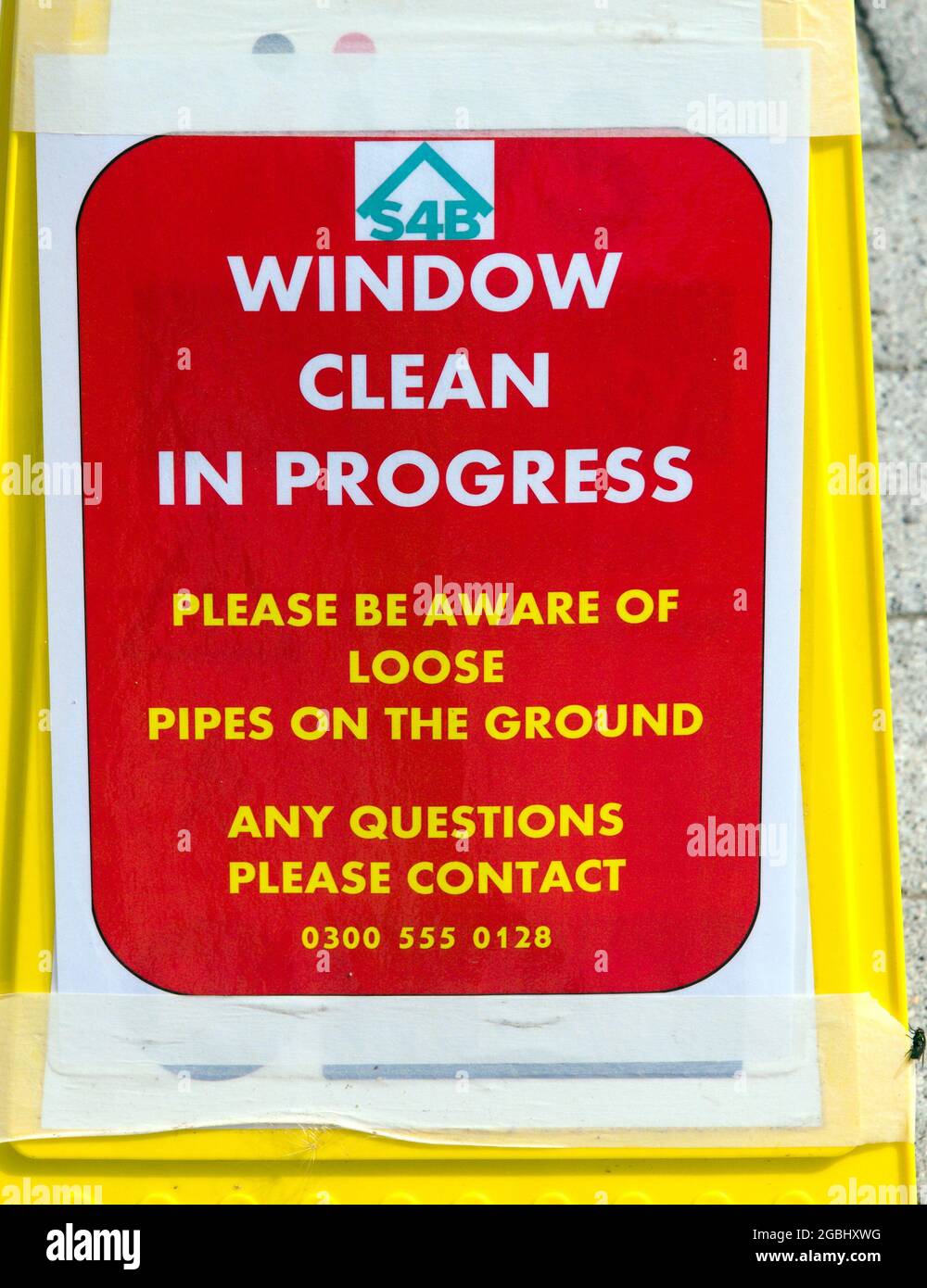 'Window clean in progress' sign by S4B housing, on a pavement in ...