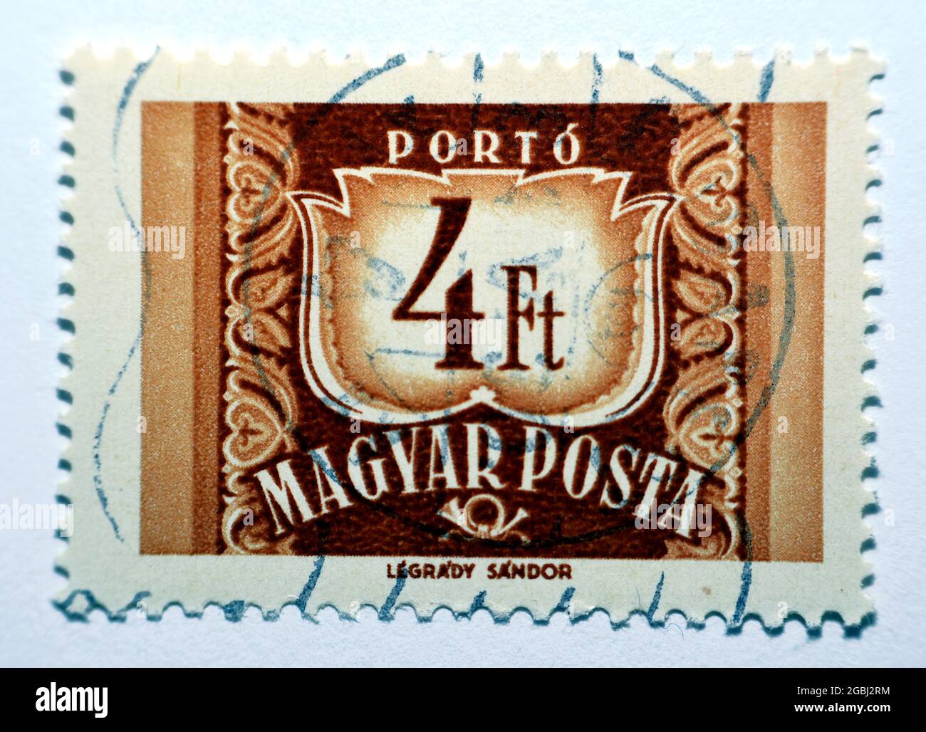 A postage stamp printed in Hungary shows value 4 Ft four Forint and ...