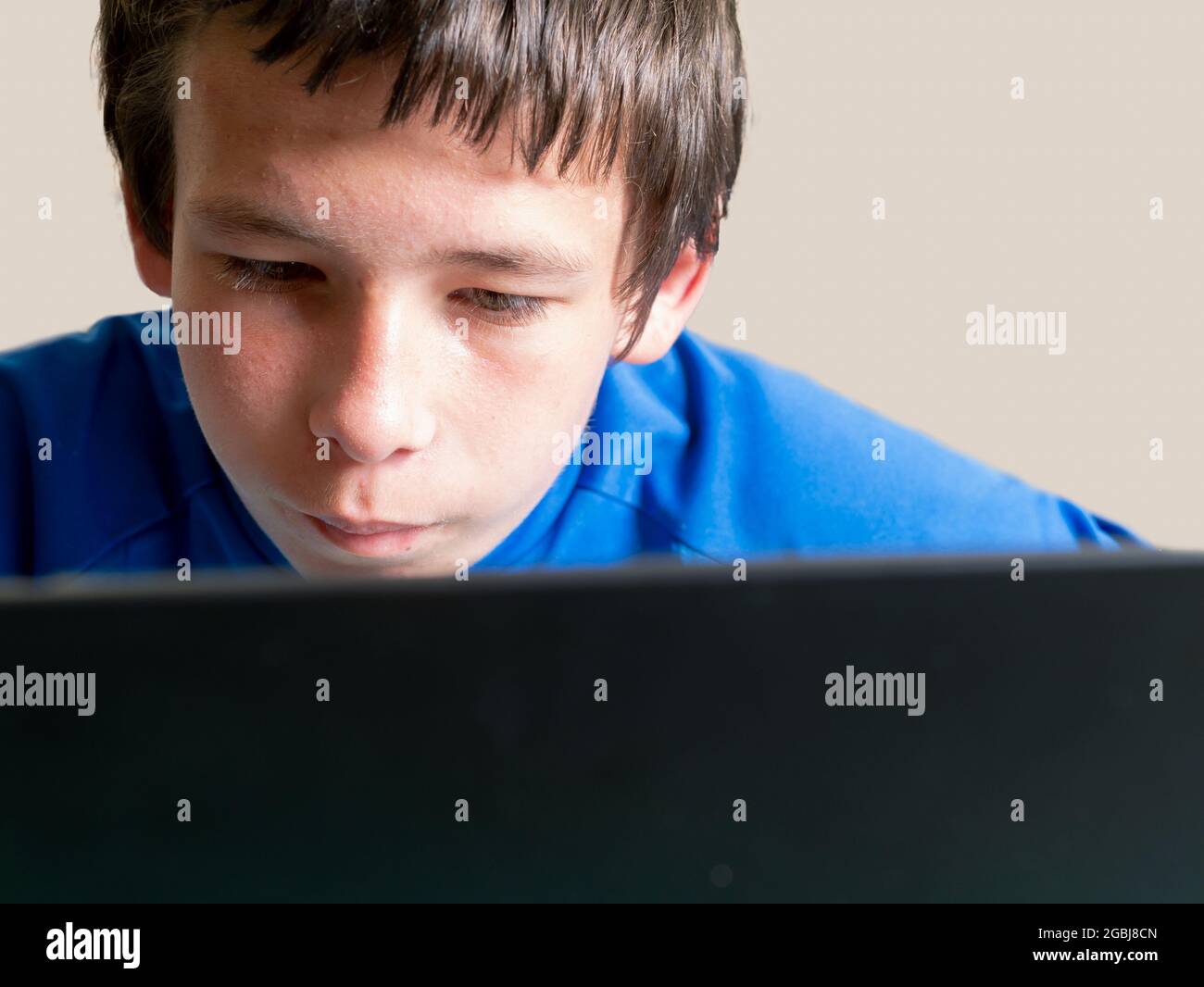 Teen Looking At A PC Monitor Stock Photo - Alamy