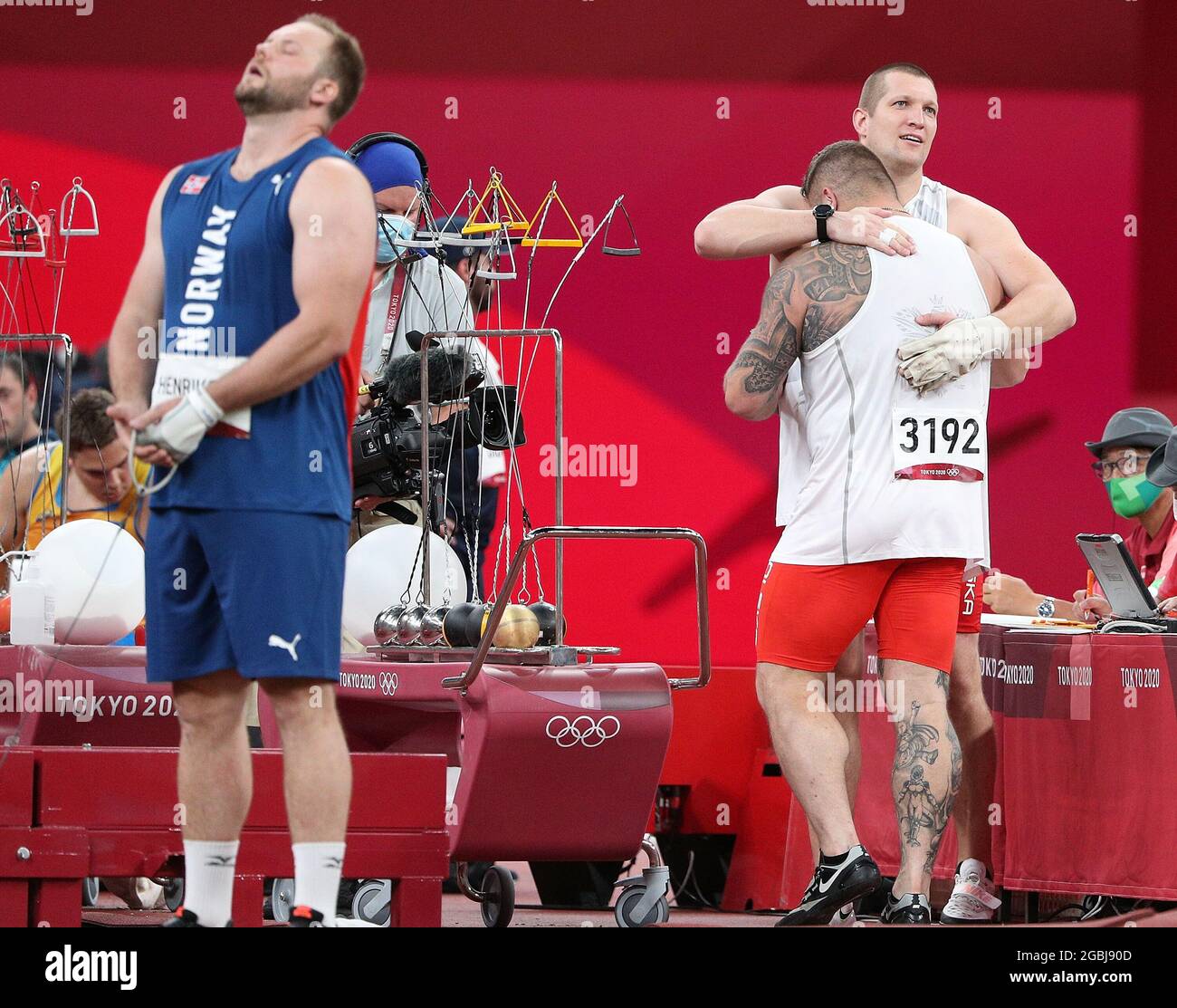 Tokyo, Japan. 4th Aug, 2021. Wojciech Nowicki (back) of Poland hugs his ...