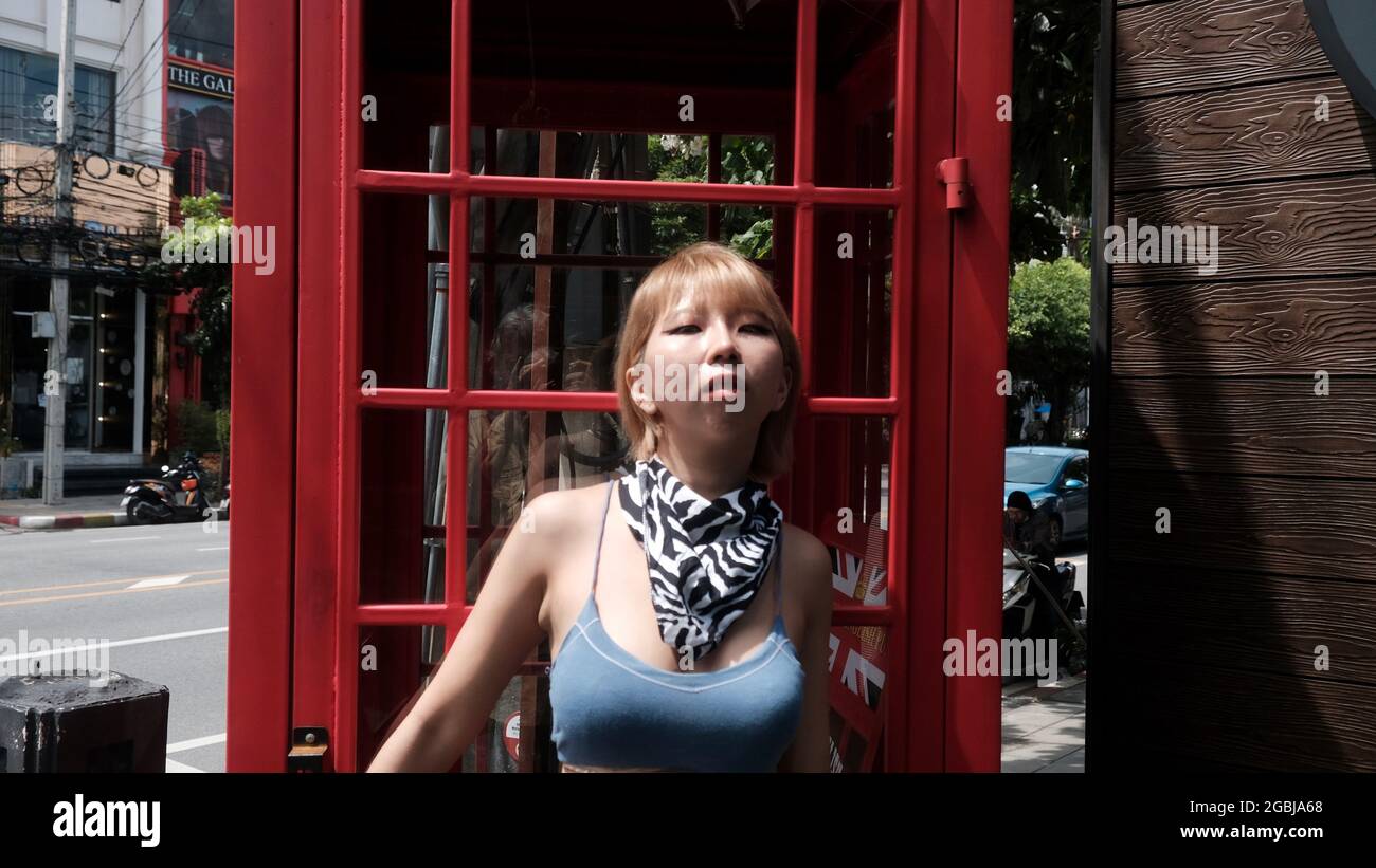 Asian Japanese Model Posing in a Red British Telephone Booth Thong Lo ...