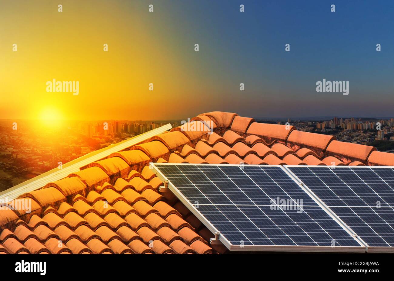 Solar energy panels over a beautiful sunset sky city backgound Stock ...